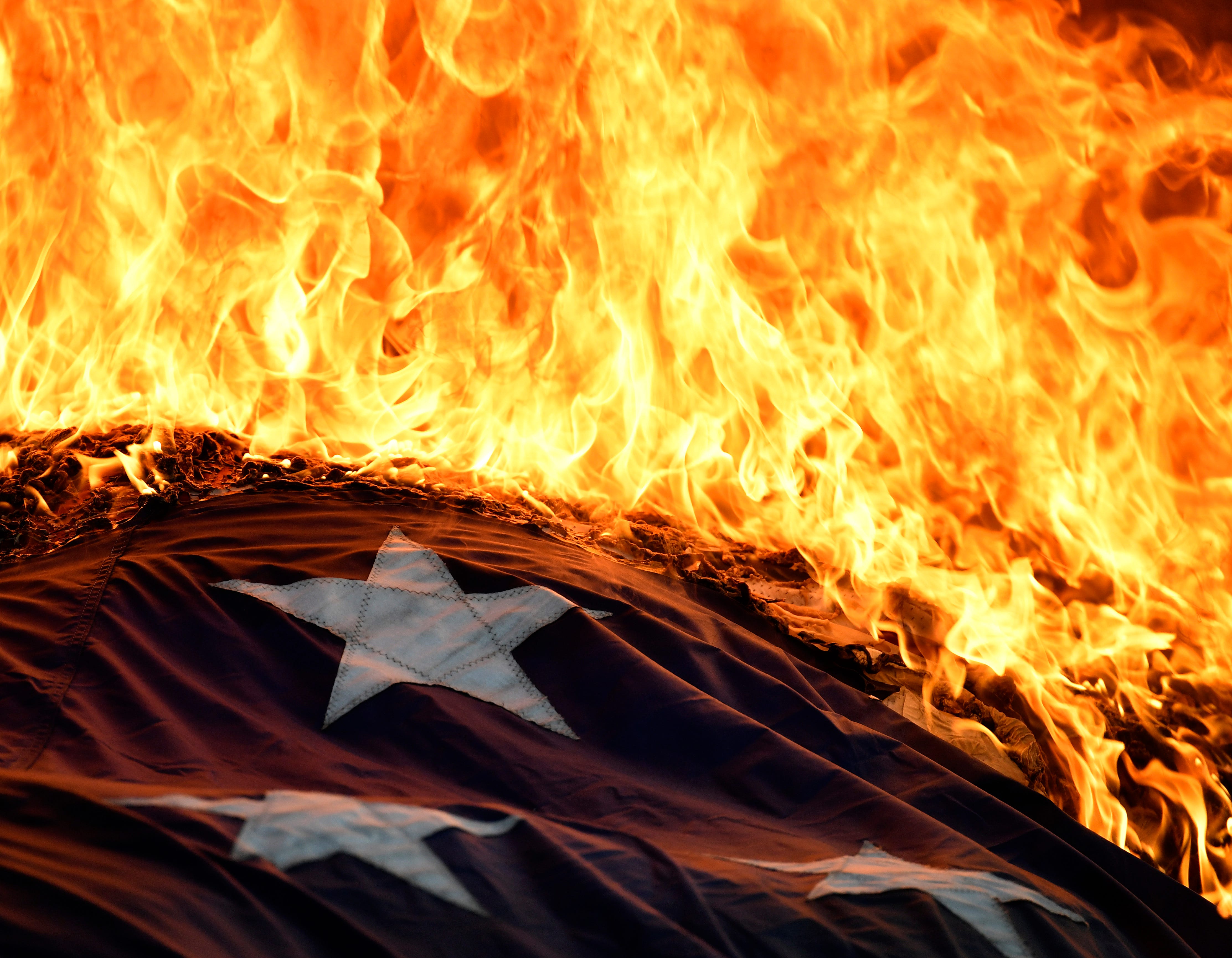 Diesel fuel. Flames. Why veterans set 25,000 flags on fire in ...